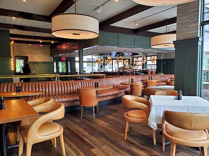 Leather booths and warm lighting create the kind of atmosphere where lingering over dinner feels mandatory.