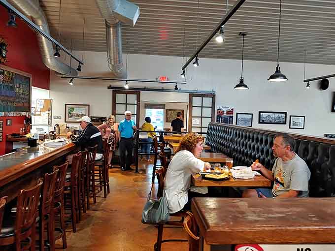 Warm lighting and comfortable booths create that perfect neighborhood spot vibe where everyone feels welcome.