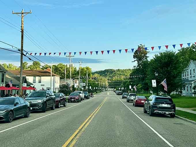 Red, white, and blue bunting signals a community that still celebrates together, not just scrolls past each other online.
