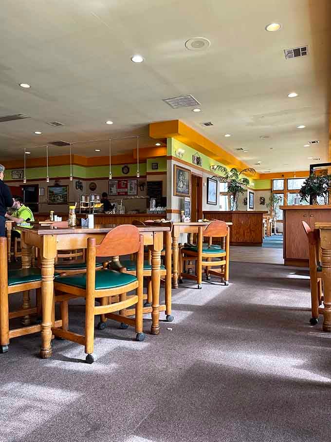 Spacious dining room with sturdy wooden tables where comfort food meets comfortable seating in perfect harmony.