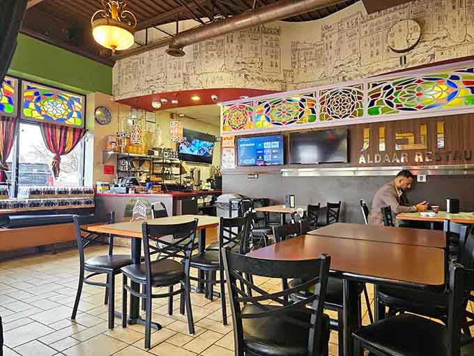 Colorful stained glass and warm lighting create an atmosphere that makes every meal feel like a celebration.