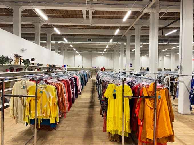 Color-coded racks stretching into the distance like a rainbow of possibilities waiting to be discovered and worn.