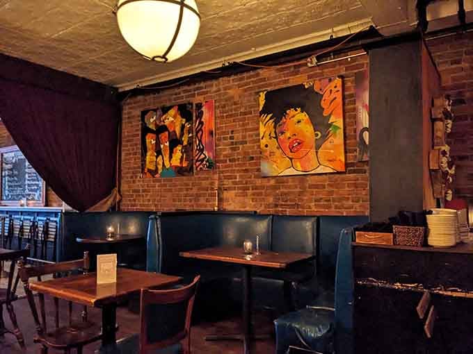 Exposed brick, leather booths, and candlelight create the kind of atmosphere where time slows down deliciously.
