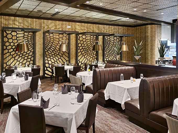The interior whispers elegance while the leather booths invite you to stay awhile and enjoy yourself.