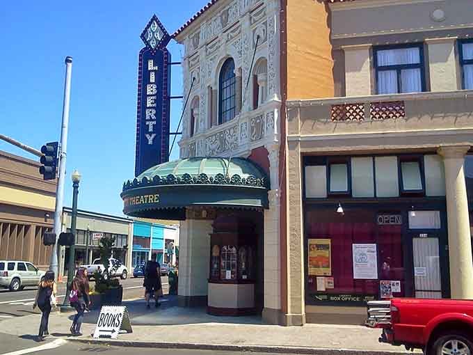 Downtown Astoria's Liberty Theatre stands proud, its vintage marquee beckoning you to explore this charming historic district.