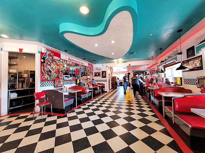 Step inside and let those checkered floors and red vinyl booths transport you straight to 1955.