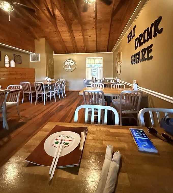 Wood beams overhead and that "EAT DRINK SHARE" philosophy on display, this dining room understands life's simple pleasures perfectly.
