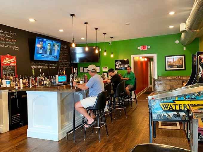 Green walls, cold beer, and arcade games create the perfect trifecta for pre-burger challenge mental preparation.