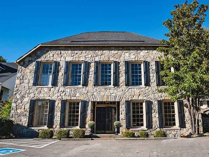 That limestone facade has witnessed more history than most museums, and those blue shutters still look sharp as ever.