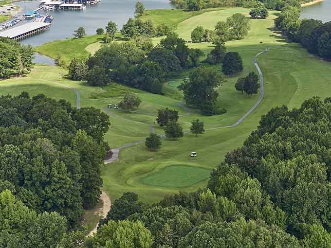 Rolling greens meet blue water where golfers discover their happy place without leaving the Bluegrass State.