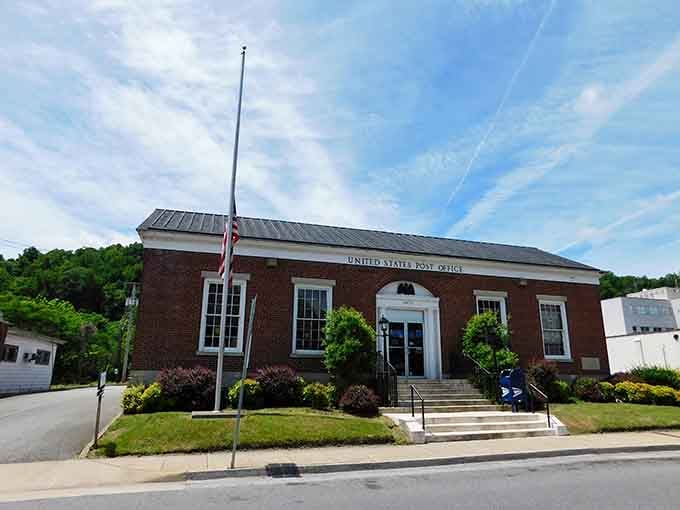 The post office stands proud in brick, a testament to small-town permanence where everyone still knows your name and your mail carrier.