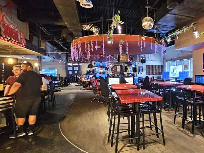 The sprawling interior glows with screens and possibility, like stepping into a gamer's fever dream.