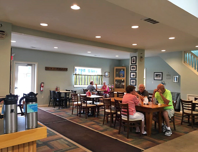 The dining area where locals gather to tackle pastries that require both hands and serious commitment.