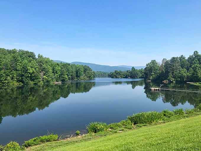 Mirror-smooth waters reflect the Blue Ridge Mountains like nature's own high-definition screen, no subscription required.