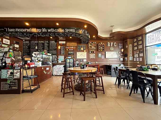 Step inside where coffee culture meets library chic, and suddenly your living room couch feels woefully inadequate.