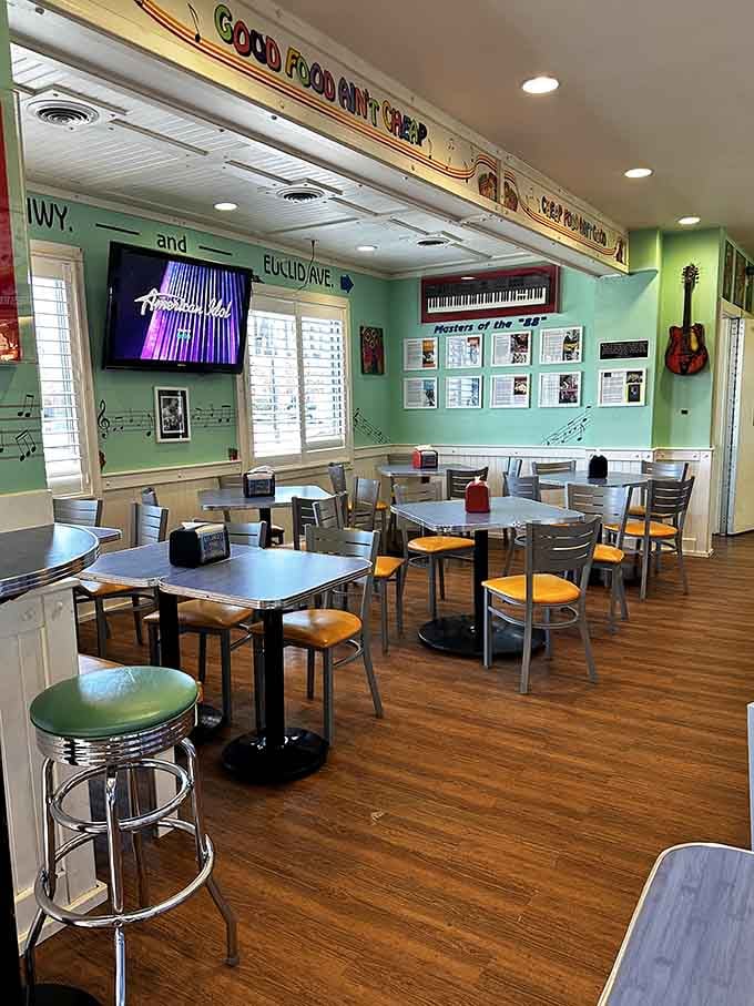 Retro diner vibes meet modern comfort in a space where chrome stools and musical nostalgia create pure dining magic.