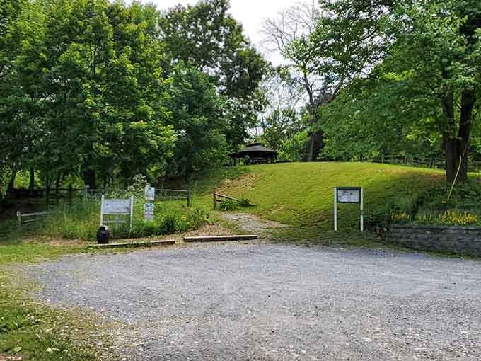 The grass-covered mound marks where iron once flowed&mdash;history literally rising from the ground beneath your feet.
