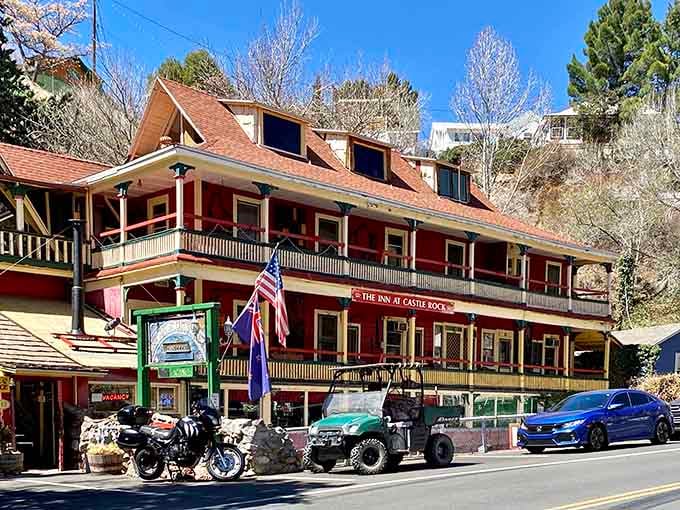 The red lodge building stands proud, reminding you that Victorian architecture never goes out of style, unlike your bell-bottoms.