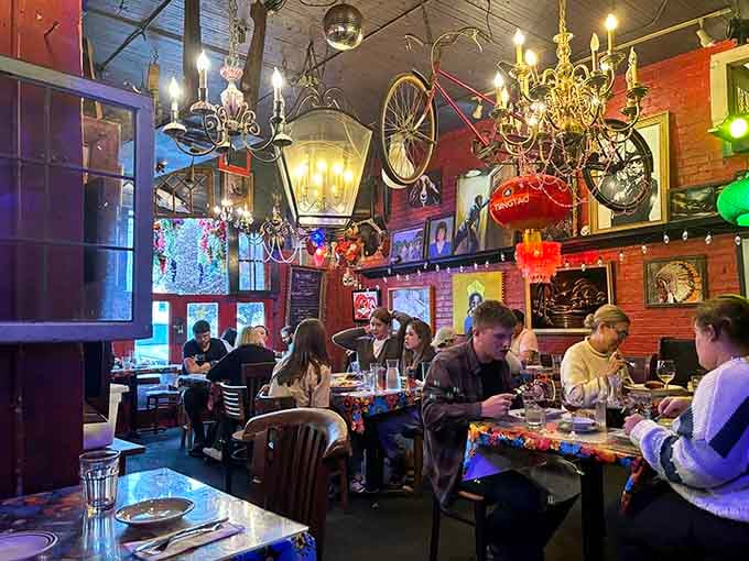 Chandeliers, bicycle wheels, and disco balls create a ceiling that's part Italian villa, part whimsical wonderland.