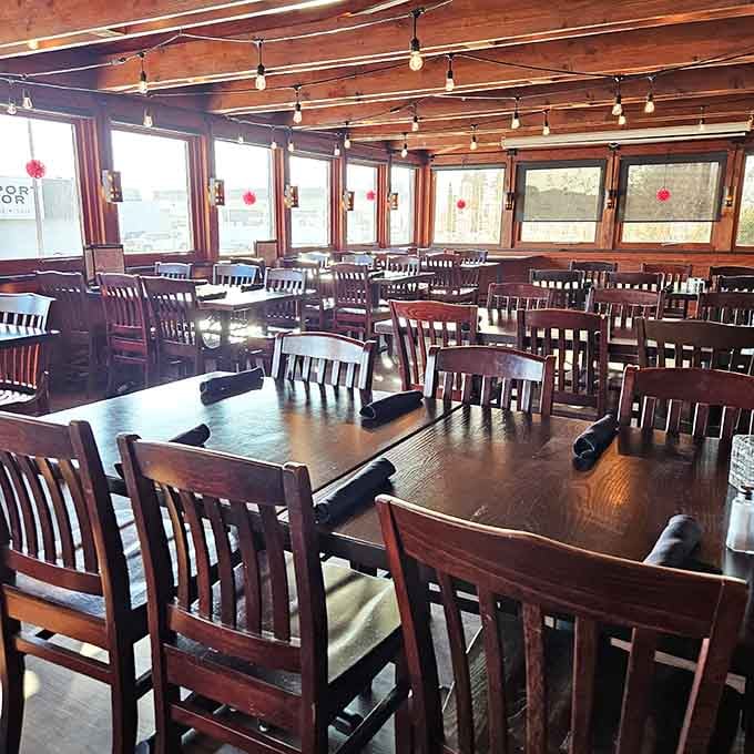 String lights and wooden tables create the kind of atmosphere where strangers become friends over shared appetizer plates.