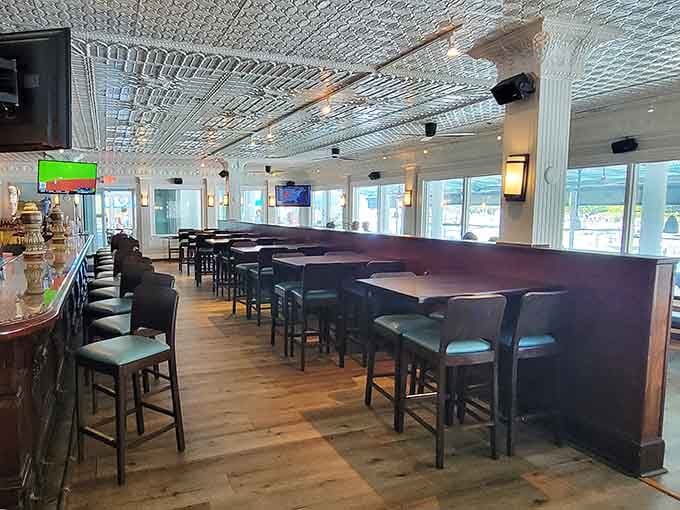 Floor-to-ceiling windows frame the waterway like living artwork, making every seat feel like the best one in the house.