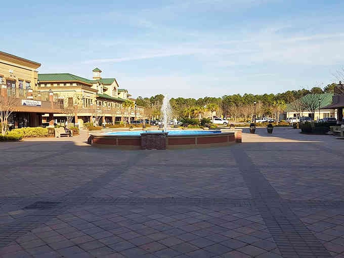 That fountain isn't just decorative; it's the town square heartbeat where community gatherings happen without requiring event tickets.
