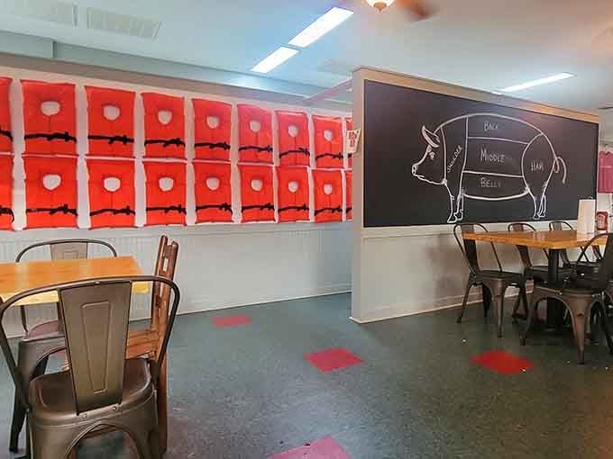 Life vests on the wall and a pig diagram remind you this place takes both fishing and smoking seriously.