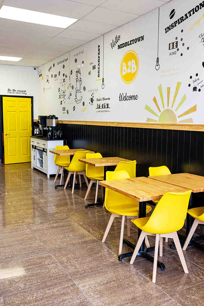 Yellow chairs and inspirational wall art create the kind of atmosphere that makes mornings feel less Monday-ish.