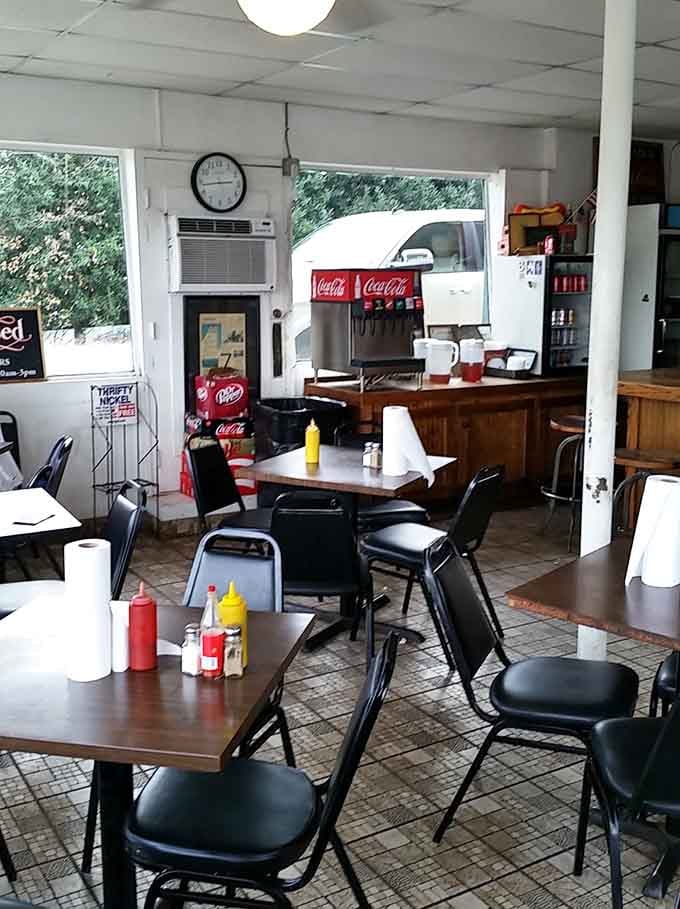 Simple tables, metal chairs, and Coca-Cola on tap: this is what honest dining looks like, folks.