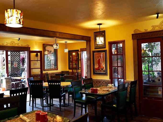 Golden walls and dark wood create the kind of warm ambiance that makes you want to cancel your afternoon plans.