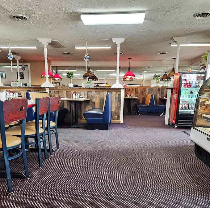 Classic diner booths meet wood-paneled charm in a space that feels like Saturday morning should feel everywhere.