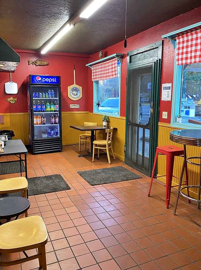 Step inside and you're greeted by red walls, checkered curtains, and the promise of seriously oversized pizza ahead.