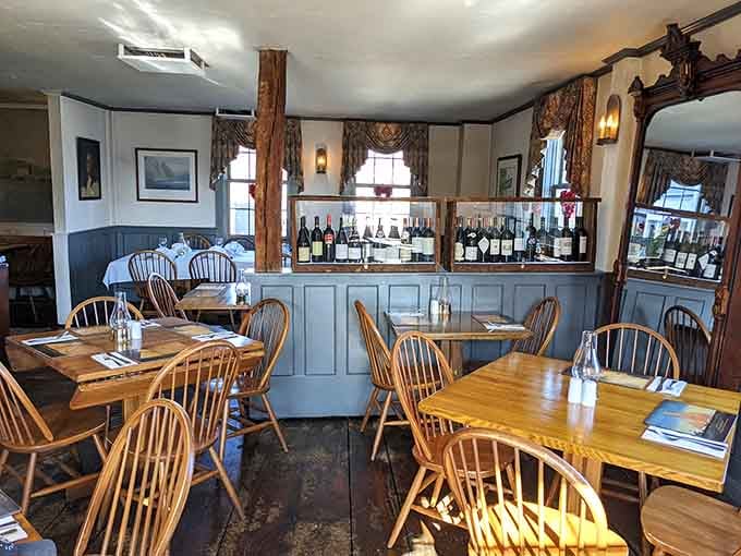 Windsor chairs and exposed beams create an atmosphere where Benjamin Franklin would feel right at home, minus the kite.