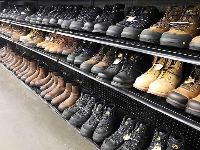 Work boots lined up like soldiers ready for duty, protecting feet and wallets simultaneously with impressive dedication.