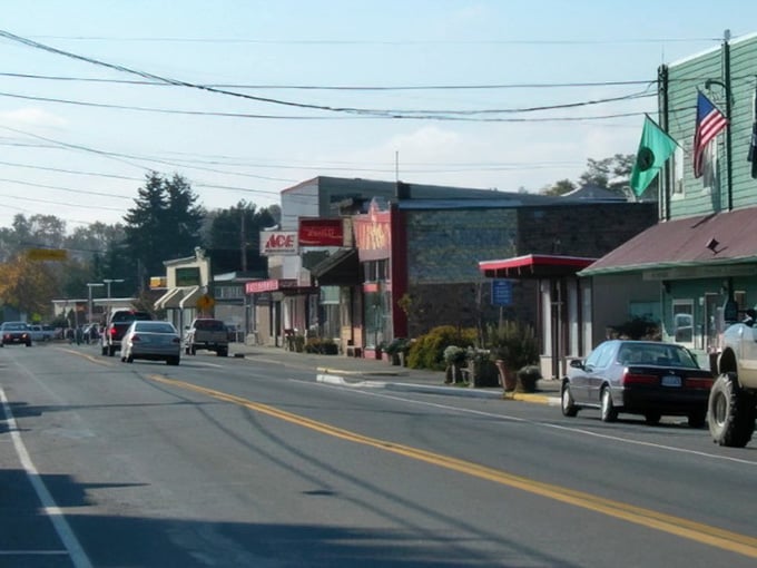 Main street where the hardware store still matters more than any app on your phone ever will.