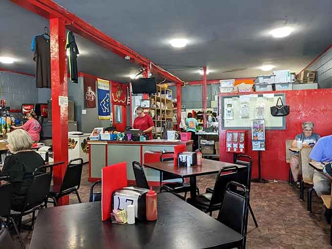 College football flags hang overhead while locals fill every table, which tells you everything you need to know.