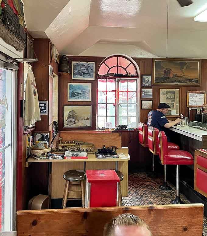 Step inside this cozy time capsule where train memorabilia meets mouthwatering burgers in perfect harmony.
