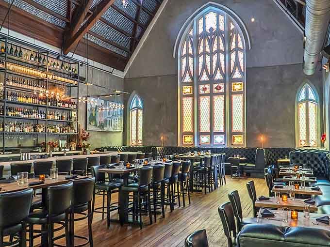 Soaring ceilings and stained glass windows create an atmosphere where every meal feels like a special occasion worth celebrating.