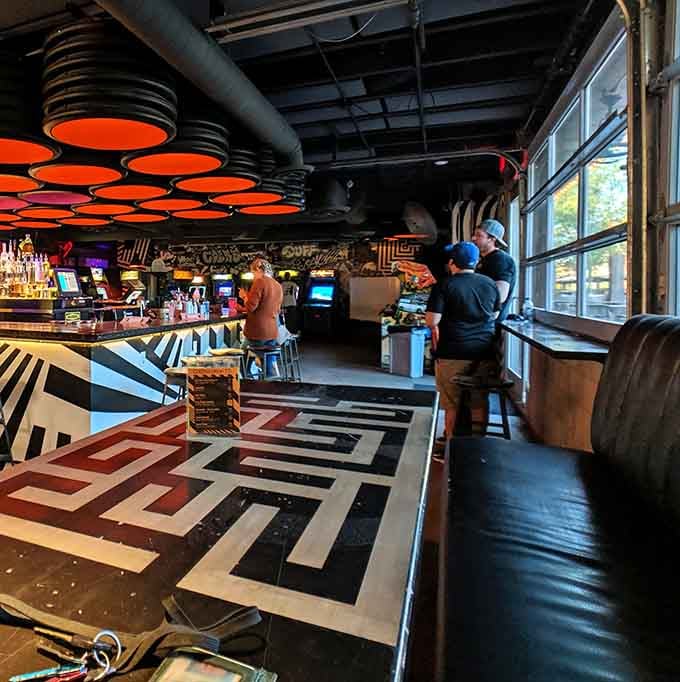 Step inside where geometric floor patterns meet glowing arcade screens, creating a visual feast for the eyes.