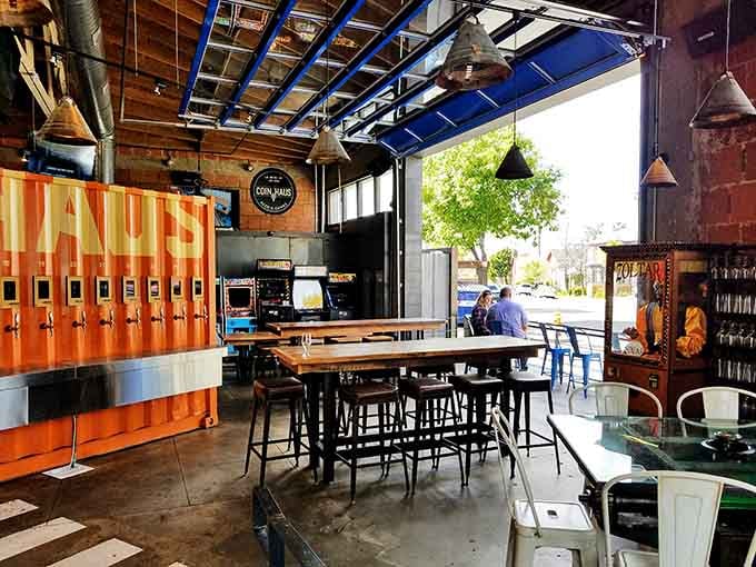 Industrial chic meets arcade nostalgia in a space that somehow feels both warehouse-cool and surprisingly welcoming.