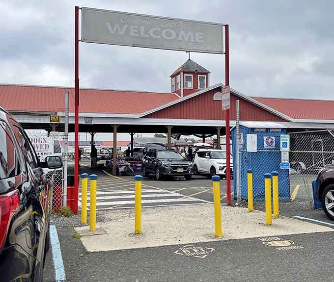 That classic welcome sign promises what lies beyond: acres of deals waiting under that distinctive red roof.