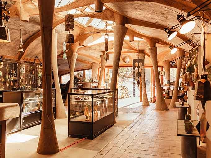 Inside feels like exploring a sculpture you can actually walk through, complete with tree-trunk columns supporting everything.