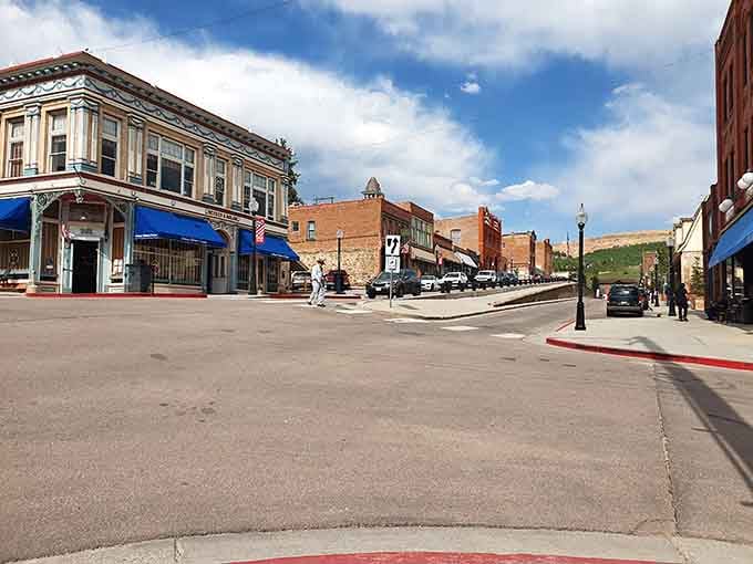 Historic storefronts stand proud under that impossibly blue Colorado sky, waiting to take your money with Victorian-era charm.