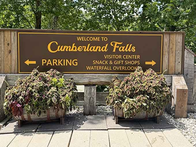 That golden script practically glows with promise, pointing you toward one of Kentucky's most spectacular natural wonders just ahead.