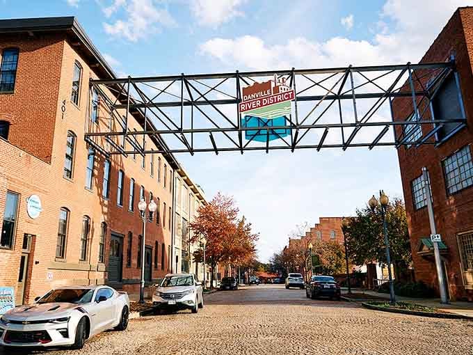 The River District's welcoming archway frames cobblestone streets where old tobacco warehouses found their second act.