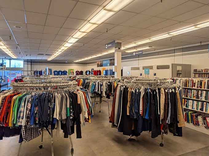 Endless racks of clothing stretch like a rainbow of second chances, organized better than most closets.