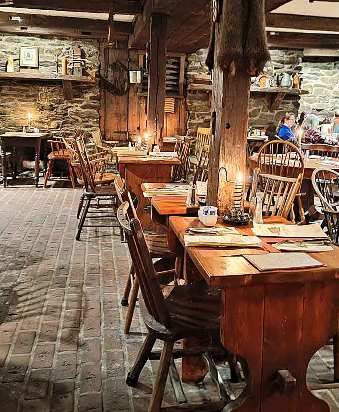 Those hand-hewn beams and stone walls create an atmosphere that modern restaurants can only dream about.