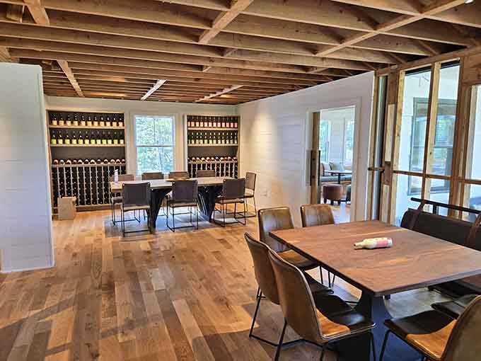 Exposed beams and natural light create a tasting room that's equal parts modern farmhouse and mountain retreat.