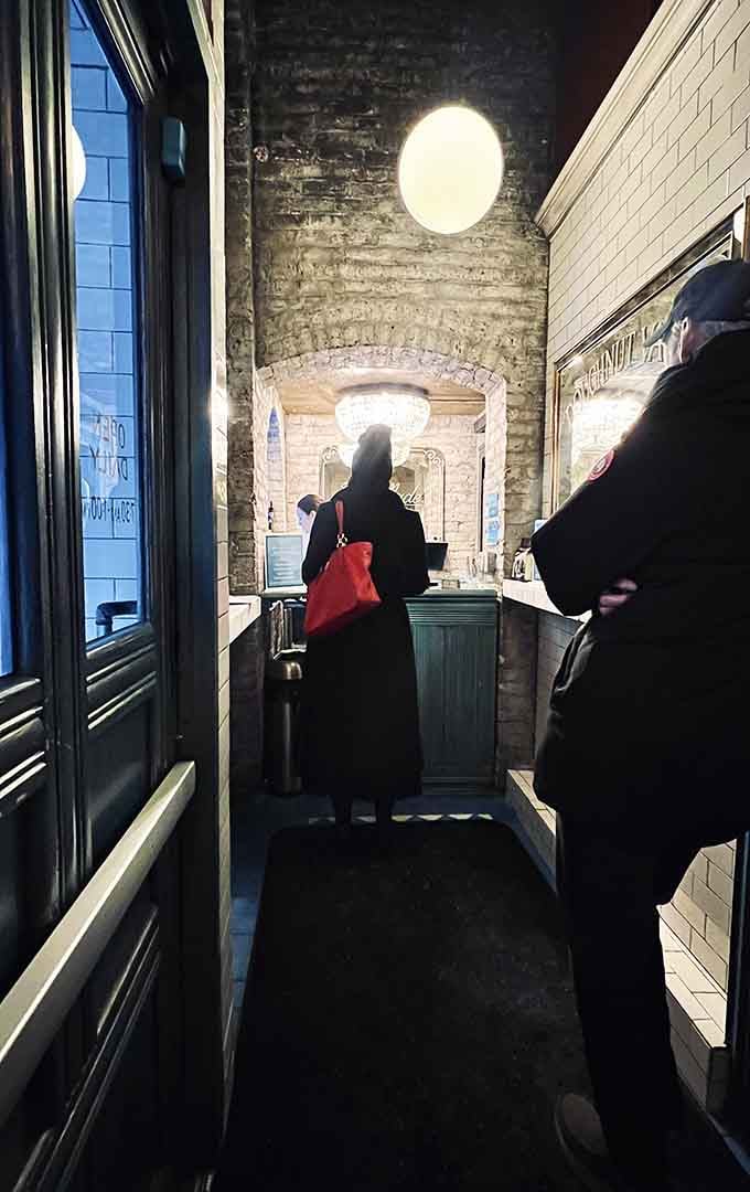 The narrow corridor feels like a secret passage leading to treasure, and honestly, that's not far off.