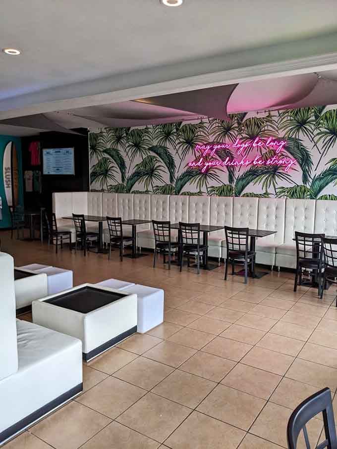 Palm fronds and pink neon transform a small-town spot into your favorite tropical escape without the airfare.
